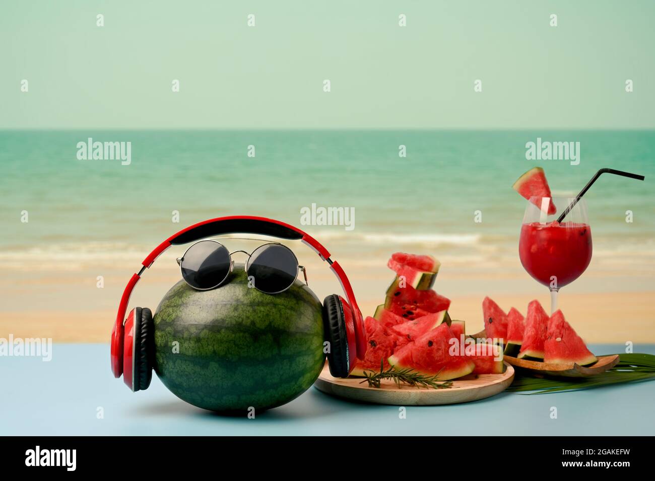 Fresh watermelon juice with summer beach in background Stock Photo - Alamy