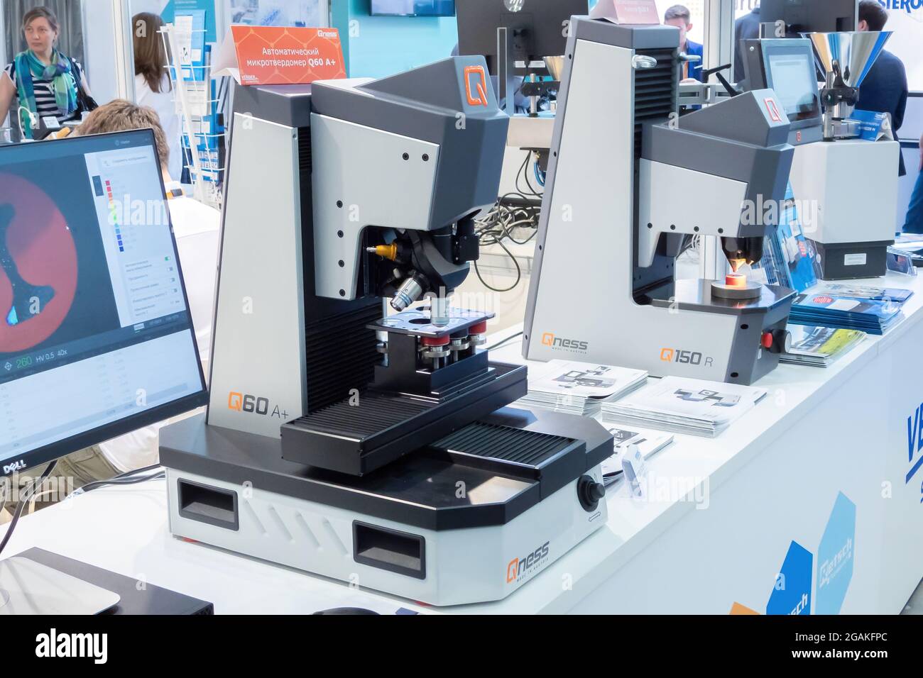 Stand with a new automatic microhardness tester Stock Photo - Alamy