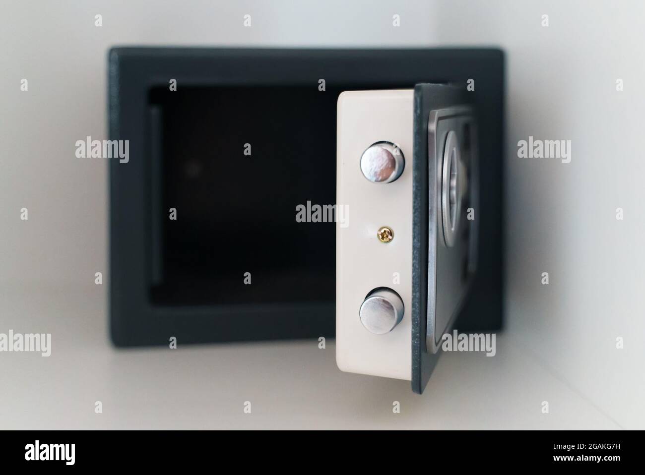 Black small home or hotel safe with keypad Stock Photo - Alamy
