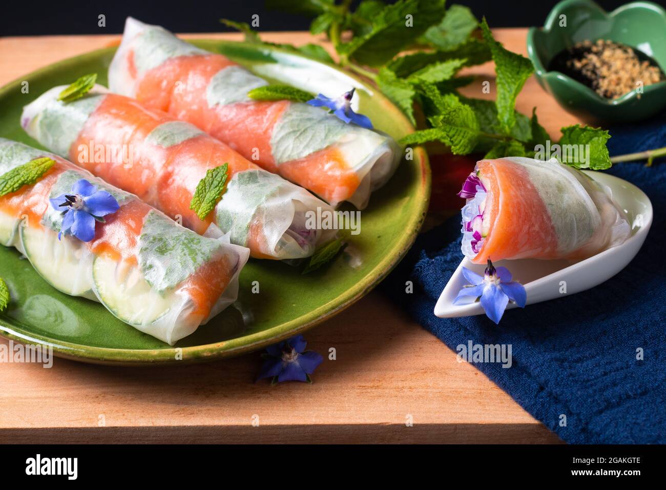 Healthy food concept Fresh smoked salmon rice paper spring rolls with ...