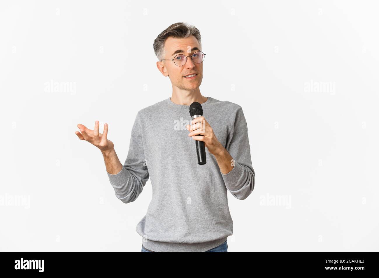Portrait of handsome middle-aged man in glasses and gray sweater ...