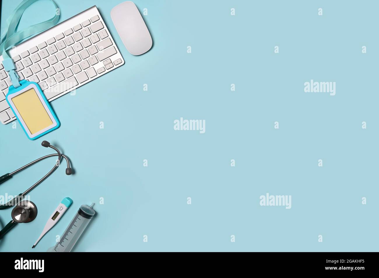 Stethoscope, keyboard and empty badge on blue background. Doctor ...