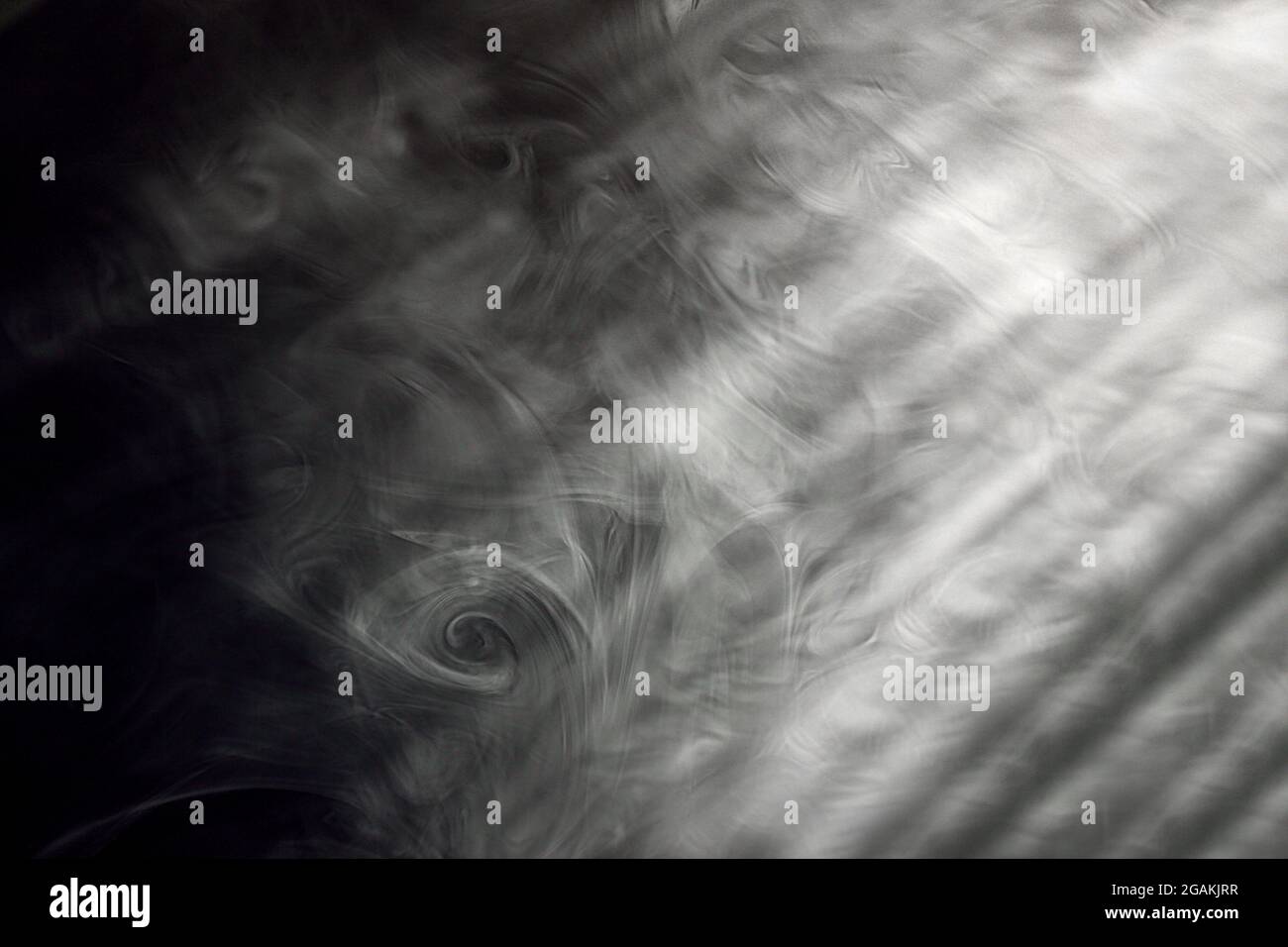 Light and smoke proceeds to the room through an open window Stock Photo ...