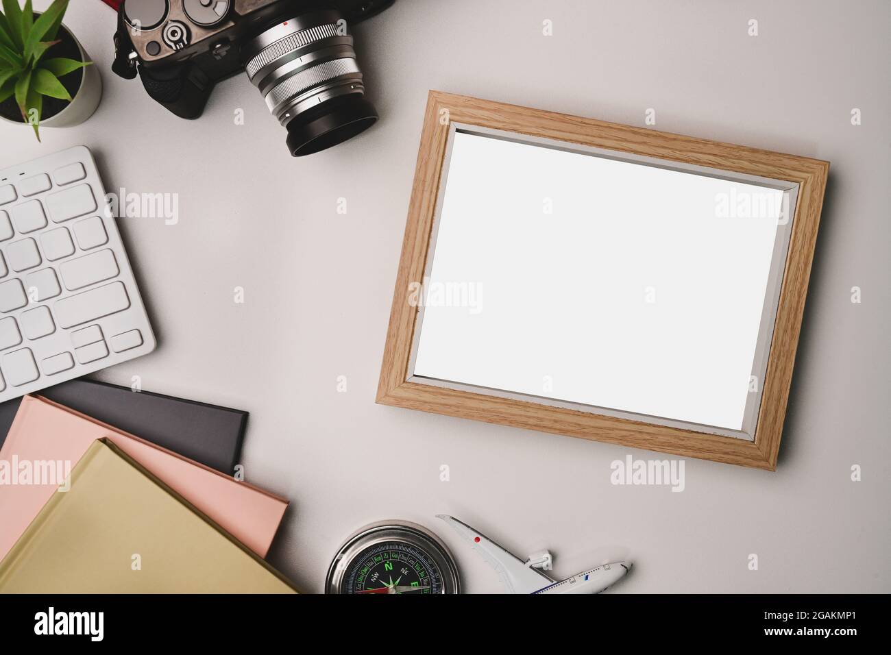 Empty photo frame, camera and notebook on photographer workspace Stock ...
