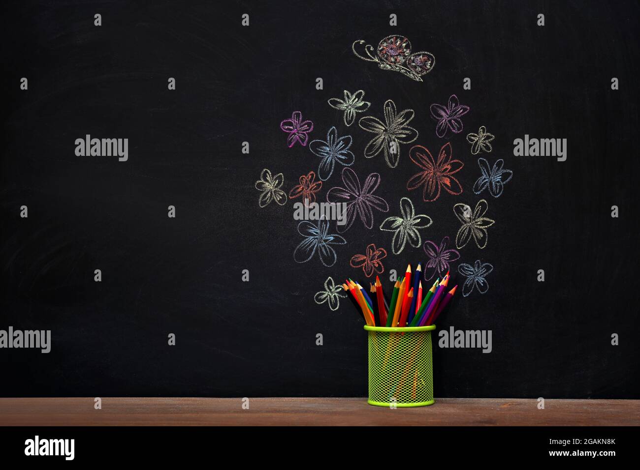 Funny composition of office supplies and pictures drawn with chalk on blackboard Stock Photo Alamy