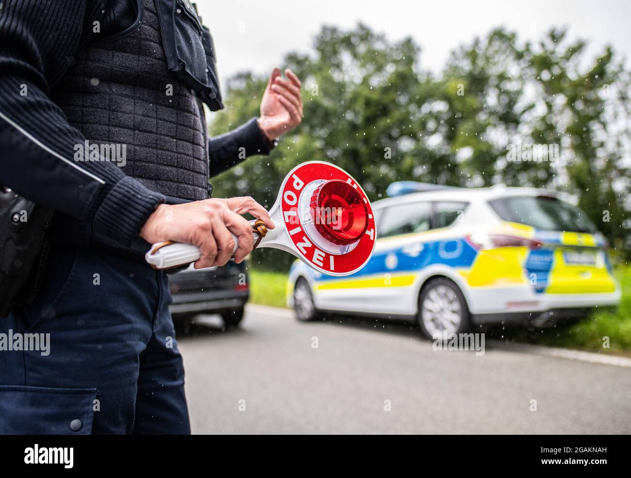 Emmerich, Germany. 31st July, 2021. A female police officer stands with ...