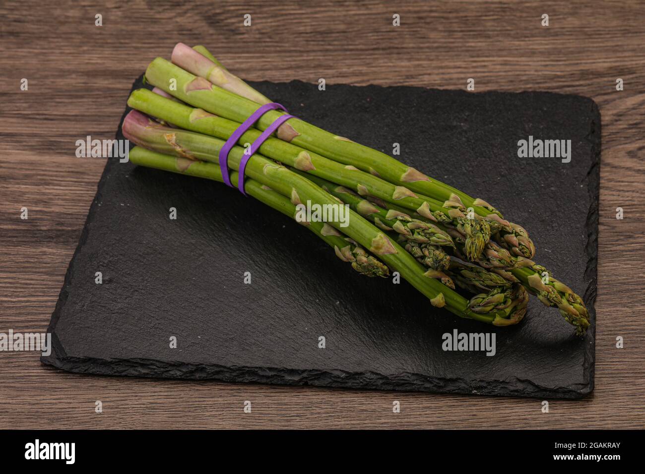 Vegan cuisine - Raw asparagus heap for cooking Stock Photo - Alamy