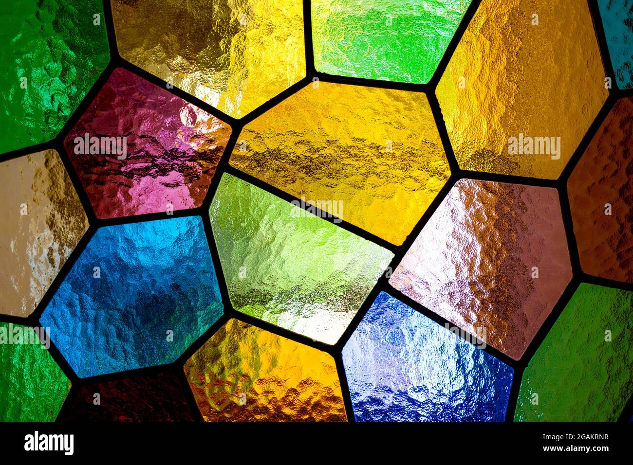 Crystals of various colors in a glass of a translucent window Stock ...
