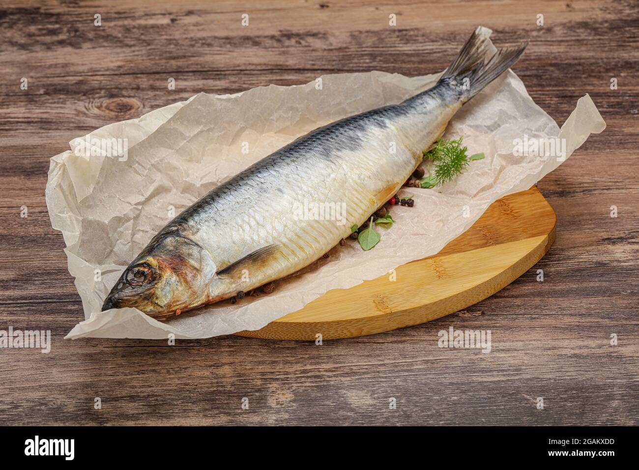 Salted Herring fish with pepper and spices Stock Photo - Alamy