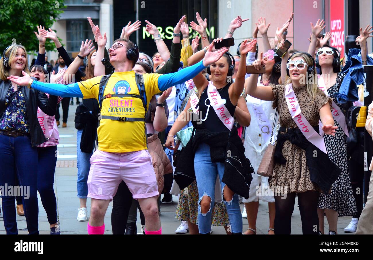 A hen party group of women, wearing headphones. on a 'Silent Adventures ...