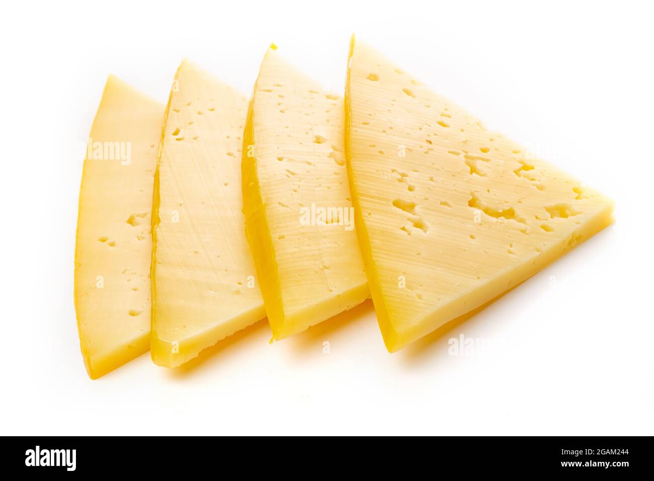 Pieces of semi-hard or hard yellow cheese with holes isolated on a ...