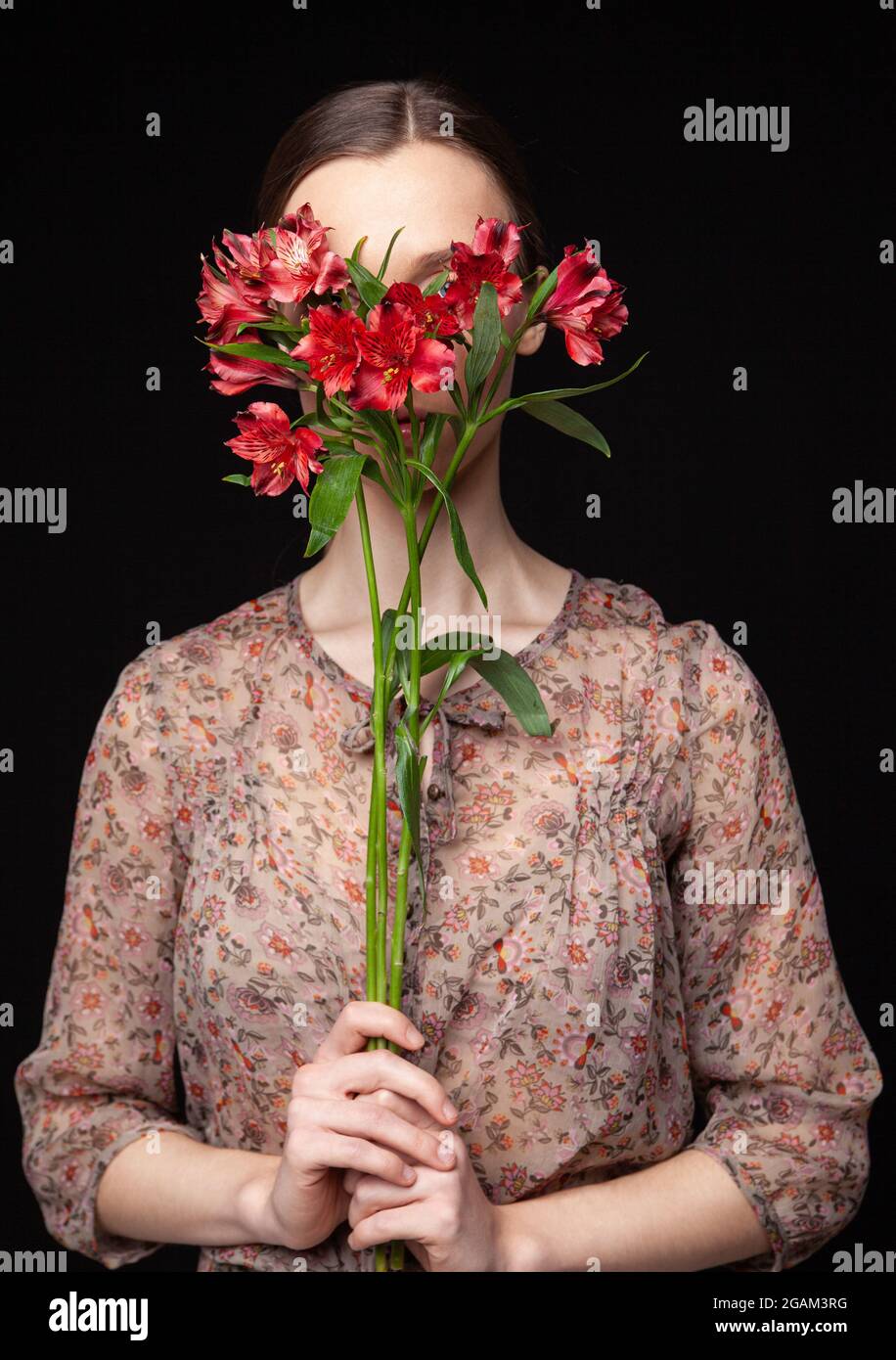 Young woman hiding behind table hi-res stock photography and images - Alamy
