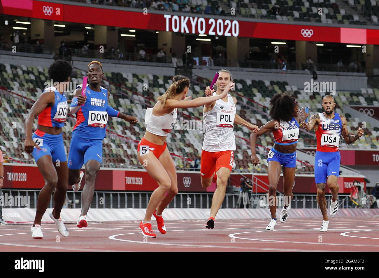 Tokyo, Japan. 31st July, 2021. Teams pass the baton in the 4X400 Mixed ...