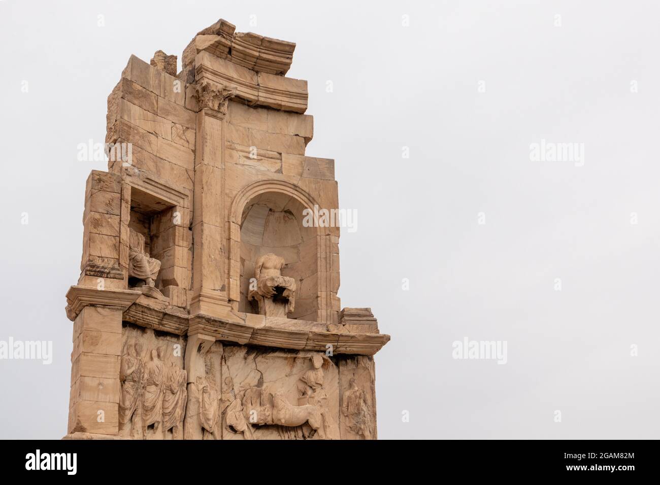 Philopappos monument in Athens on Filopappou Hill on gray cloudy sky ...
