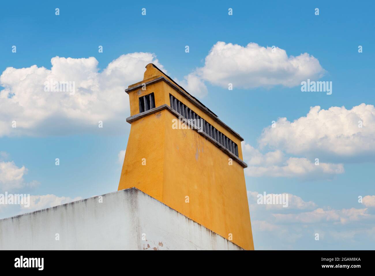 Typical large ancient chimneys on tile roofs in Portuguese architecture ...