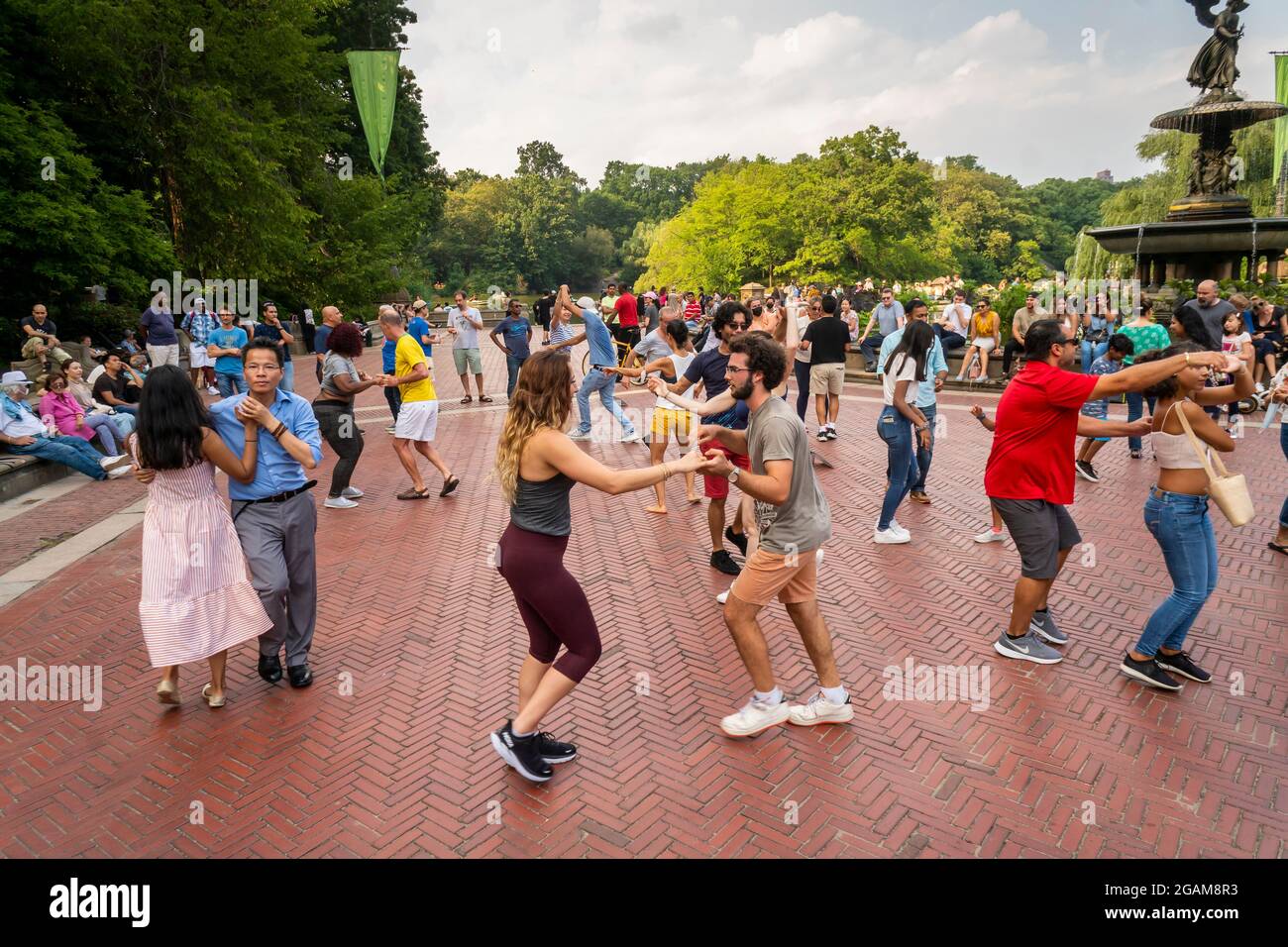 Visitors to Central Park in Bethesda Plaza in New York participate in ...