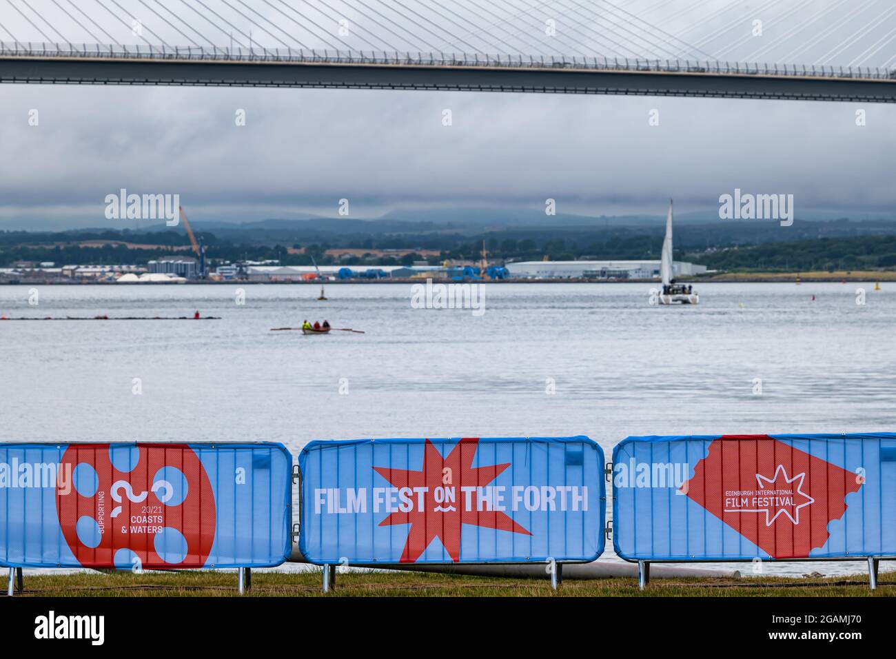 Catamaran and coastal rowing boat sailing at Edinburgh International ...