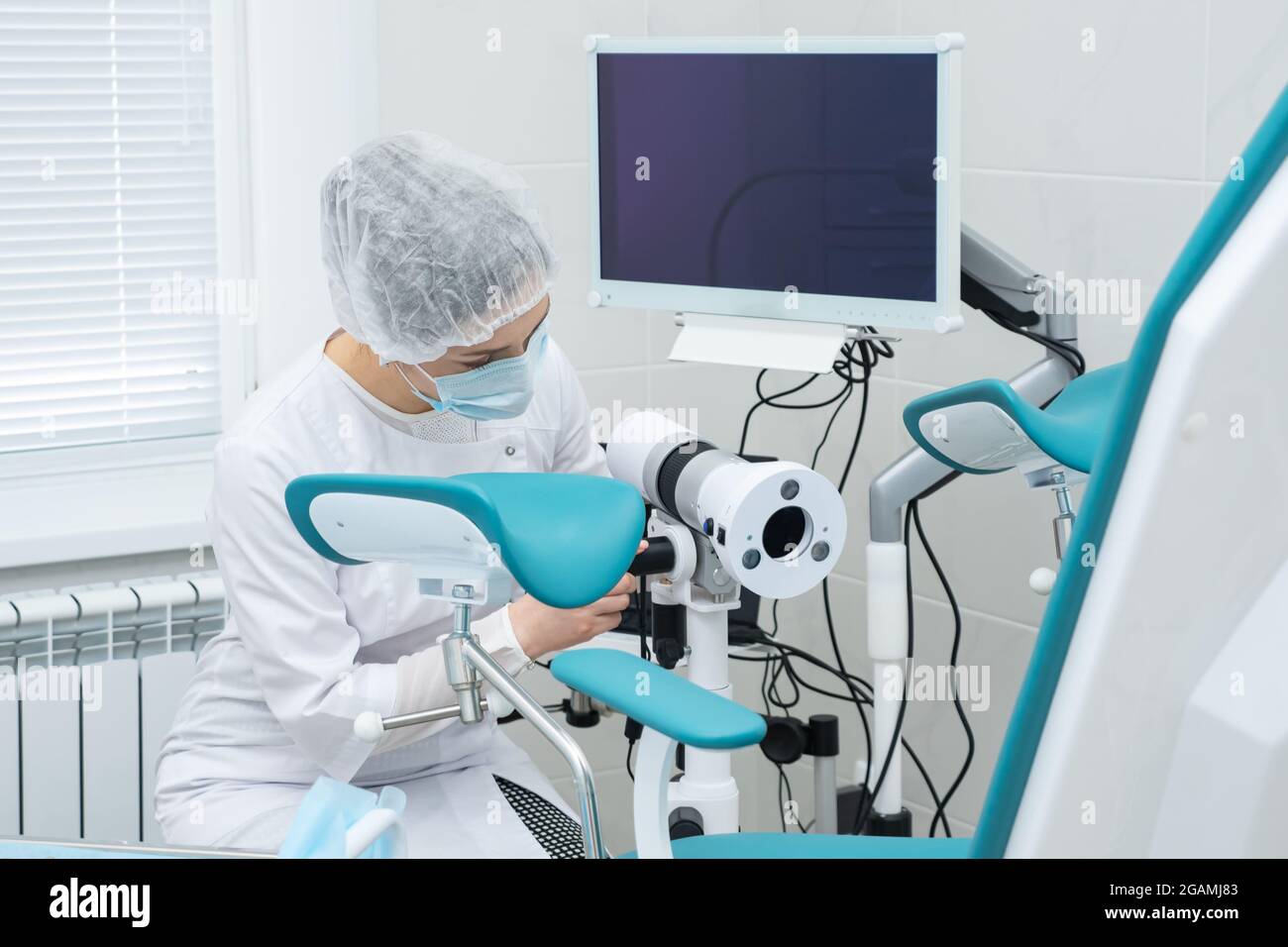 doctor prepares the colposcope before the patient arrives Stock Photo ...