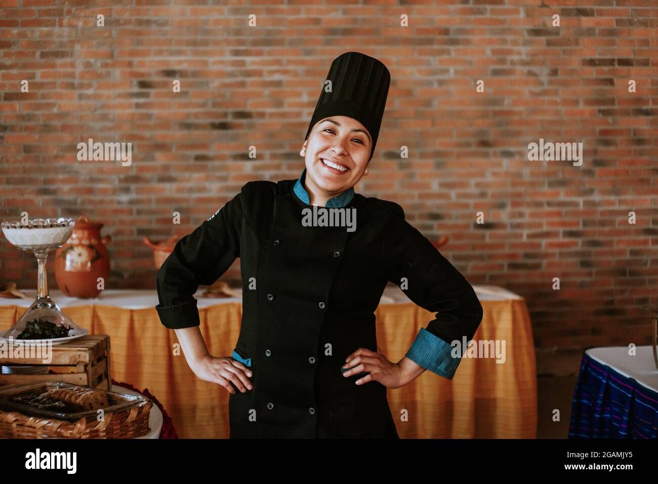 Portrait of latin female chef smiling in mexican restaurant Stock Photo ...