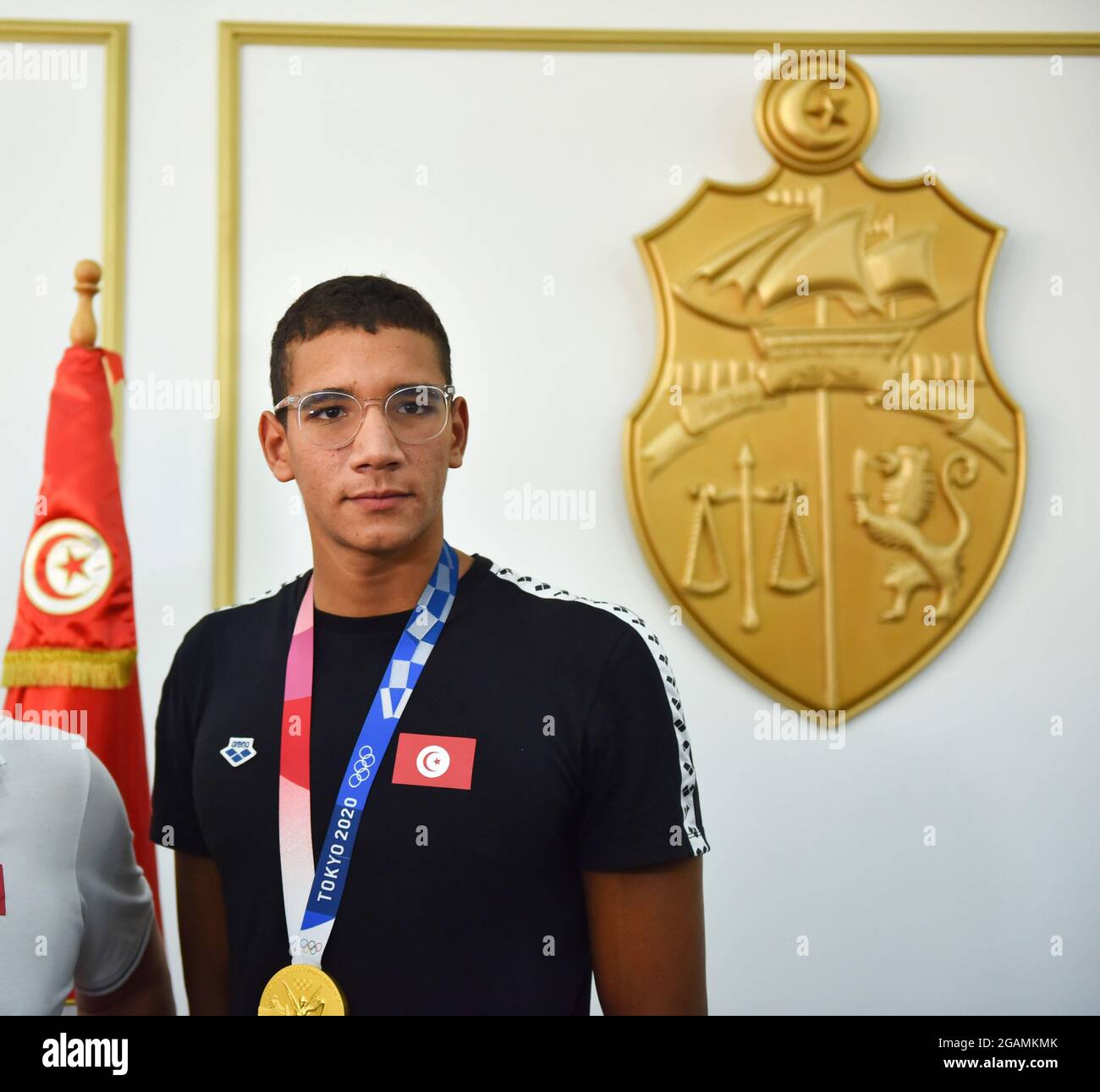 Tunisia's Gold medalist swimmer, Ahmed Hafnaoui poses with his medal as ...