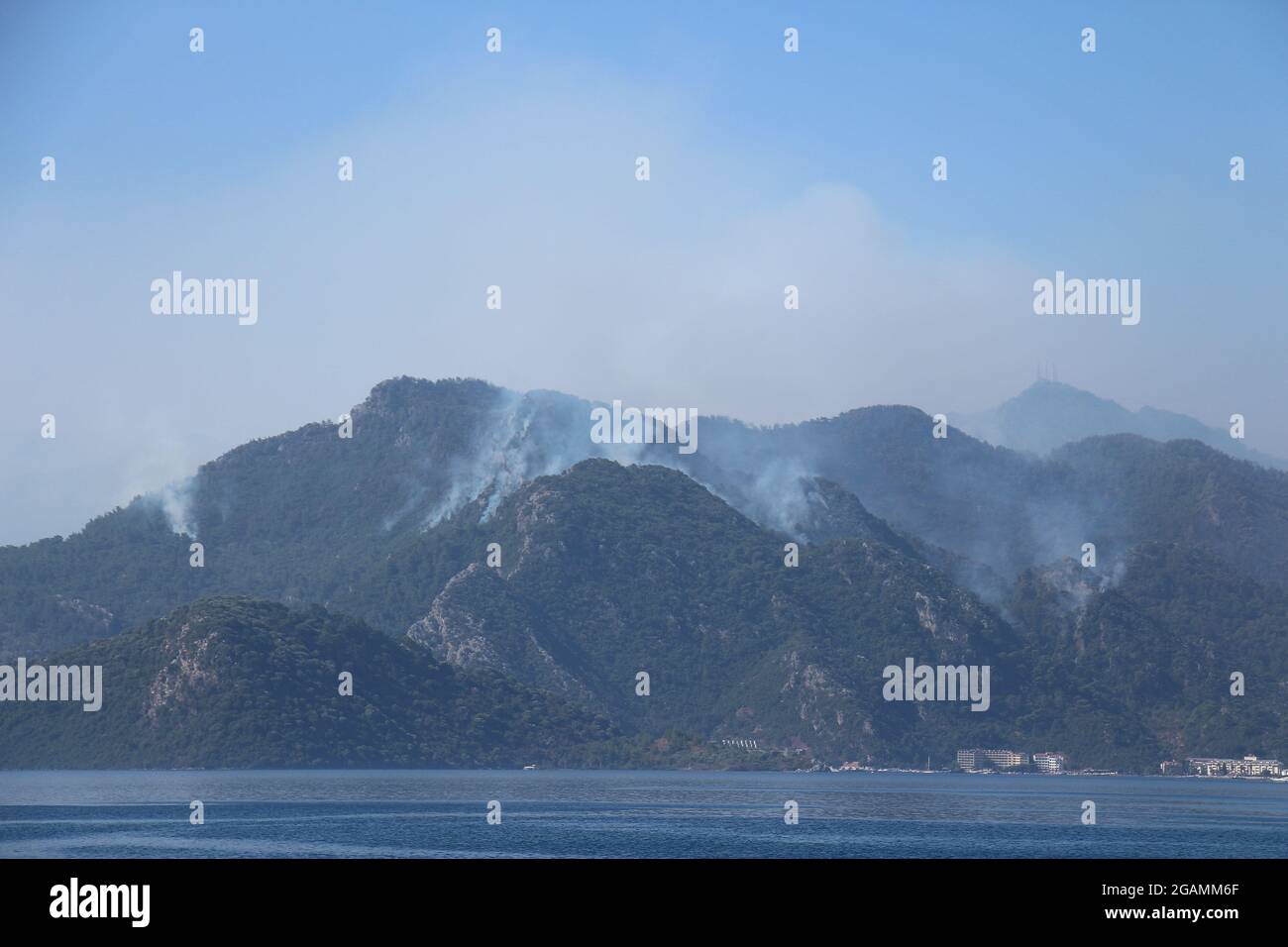 Smoke rises from a forest fire in Marmaris district in Mugla, Turkey ...