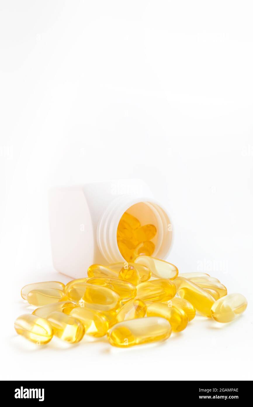 omega 3 pills pouring out of the jar on a white background Stock Photo ...