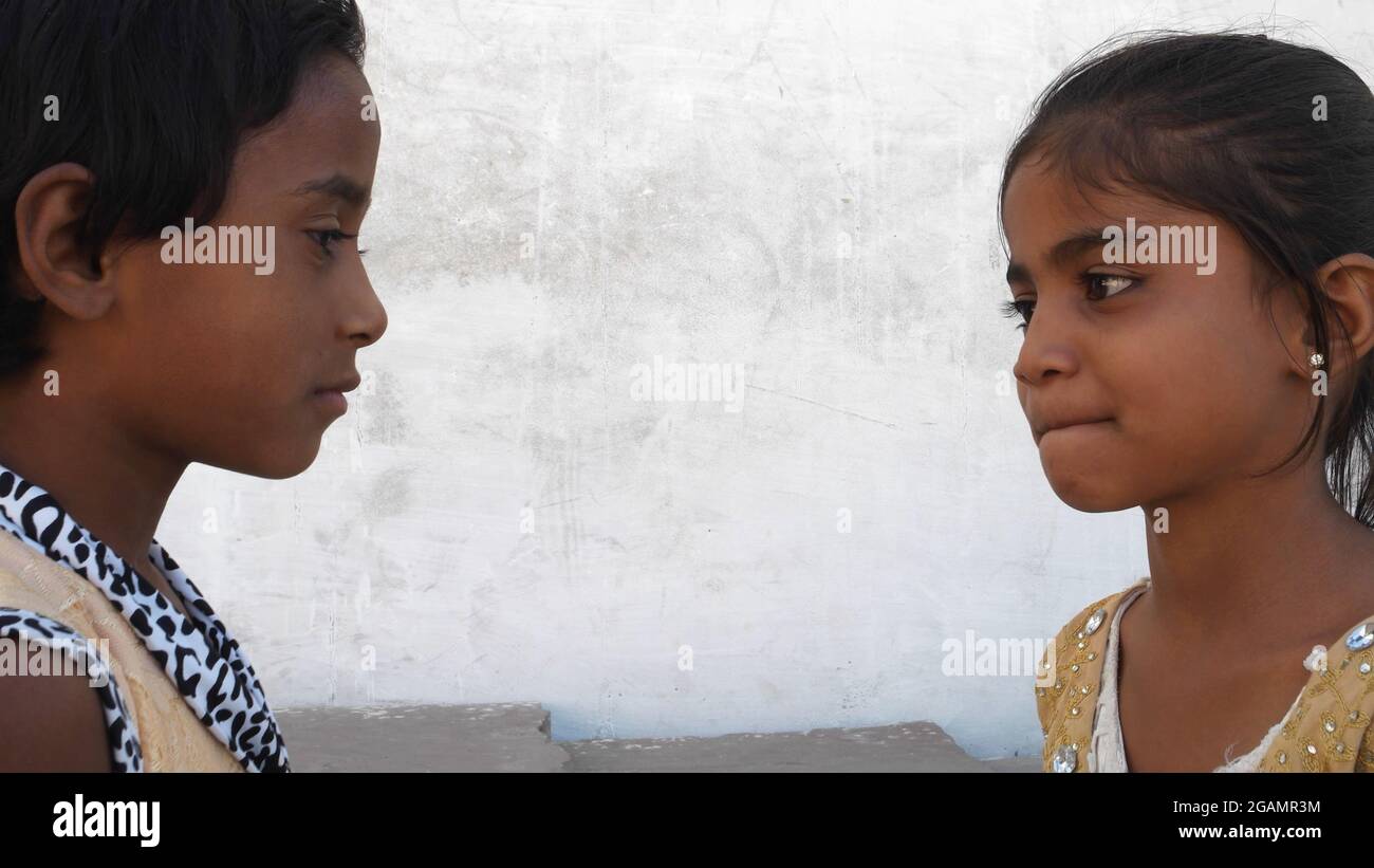 Closeup shot of two Indian female kids looking at each other Stock ...