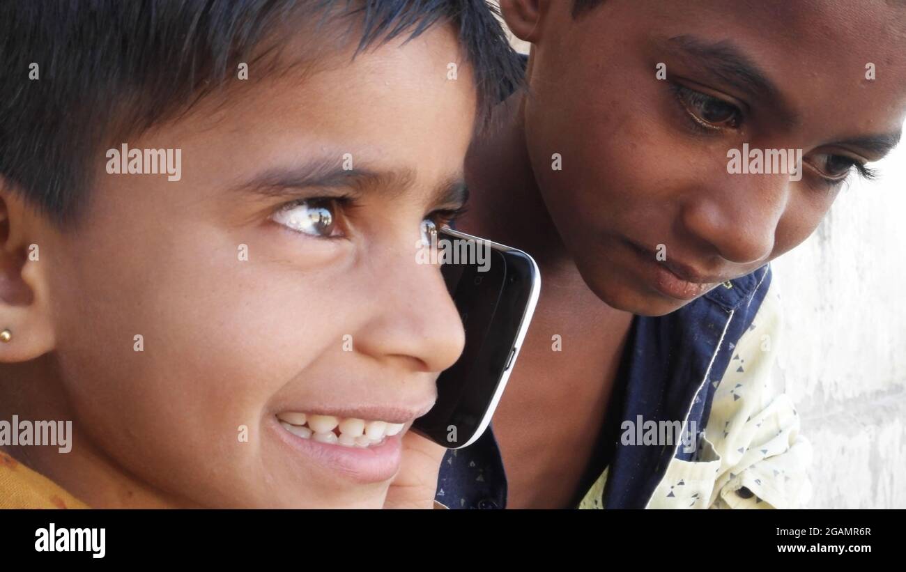 Indian kids talking mobile hi-res stock photography and images - Alamy