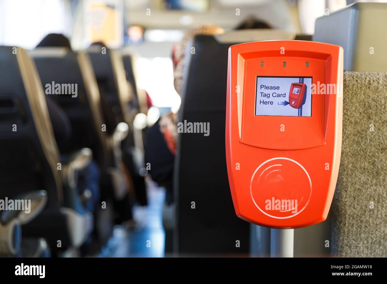Orange ticket validation machine on a modern public transport bus Stock ...