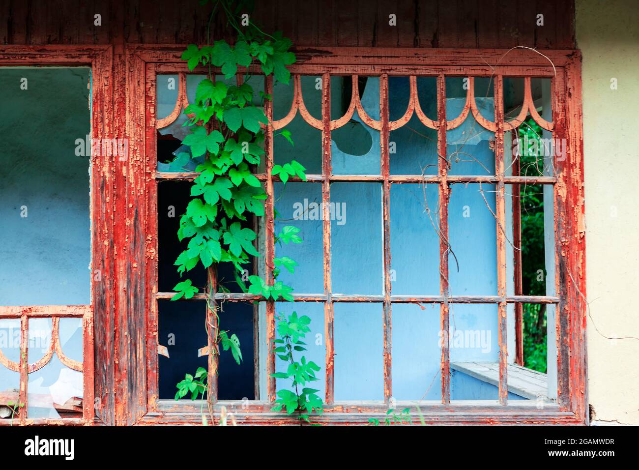 Wooden broken window of deserted house Stock Photo - Alamy