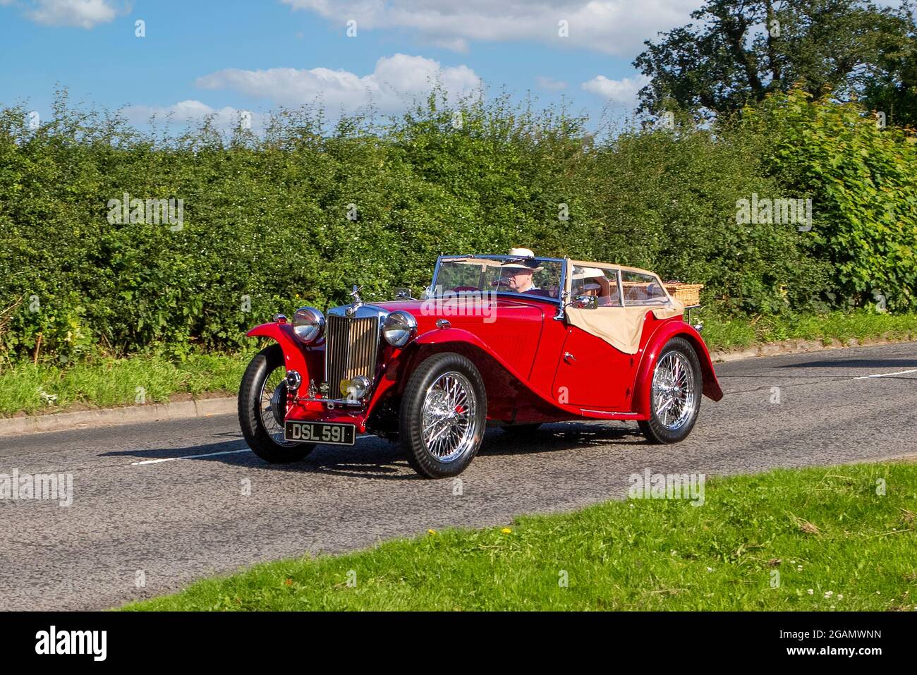 A 1949 40s MG TC Red classic vintage car arriving at the Capesthorne ...