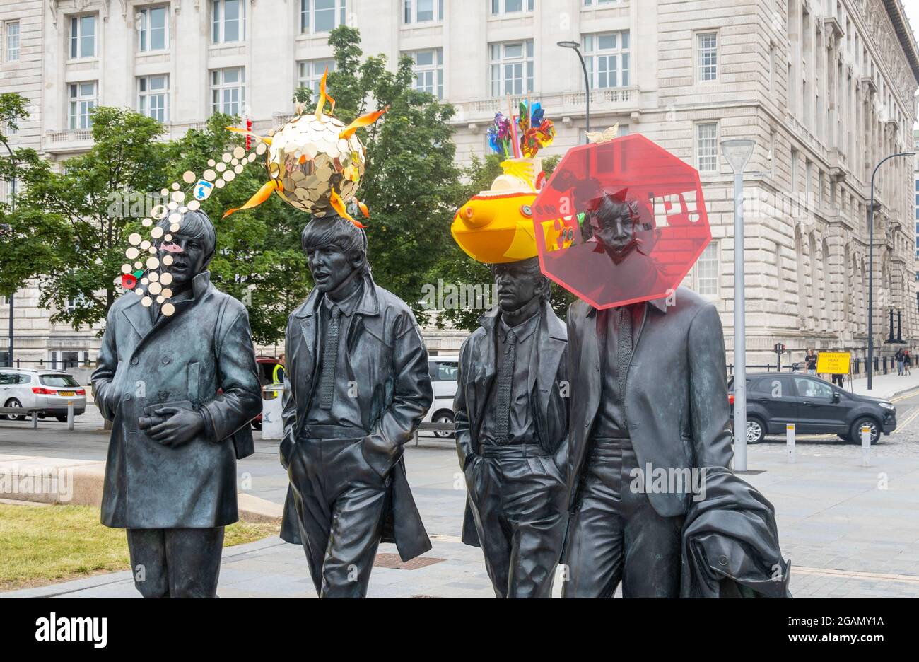 The Beatles statue by Andy Edwards is redressed by artist Stephen Jones ...