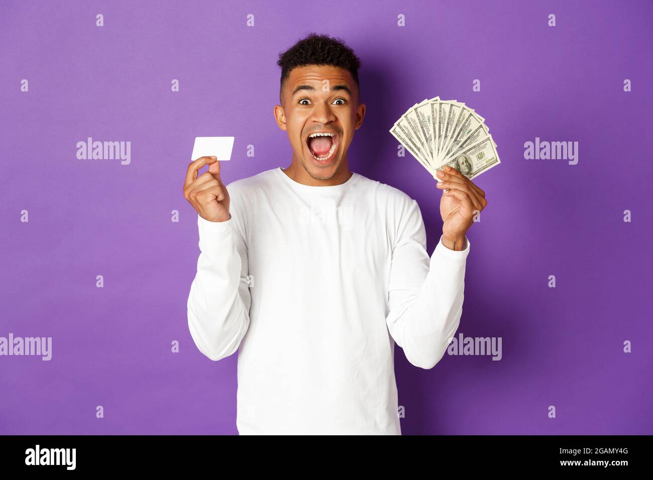 Image of handsome african american guy, looking pleased and smiling ...