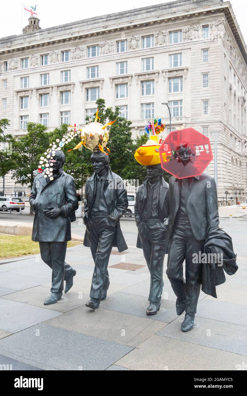 The Beatles statue by Andy Edwards is redressed by artist Stephen Jones ...