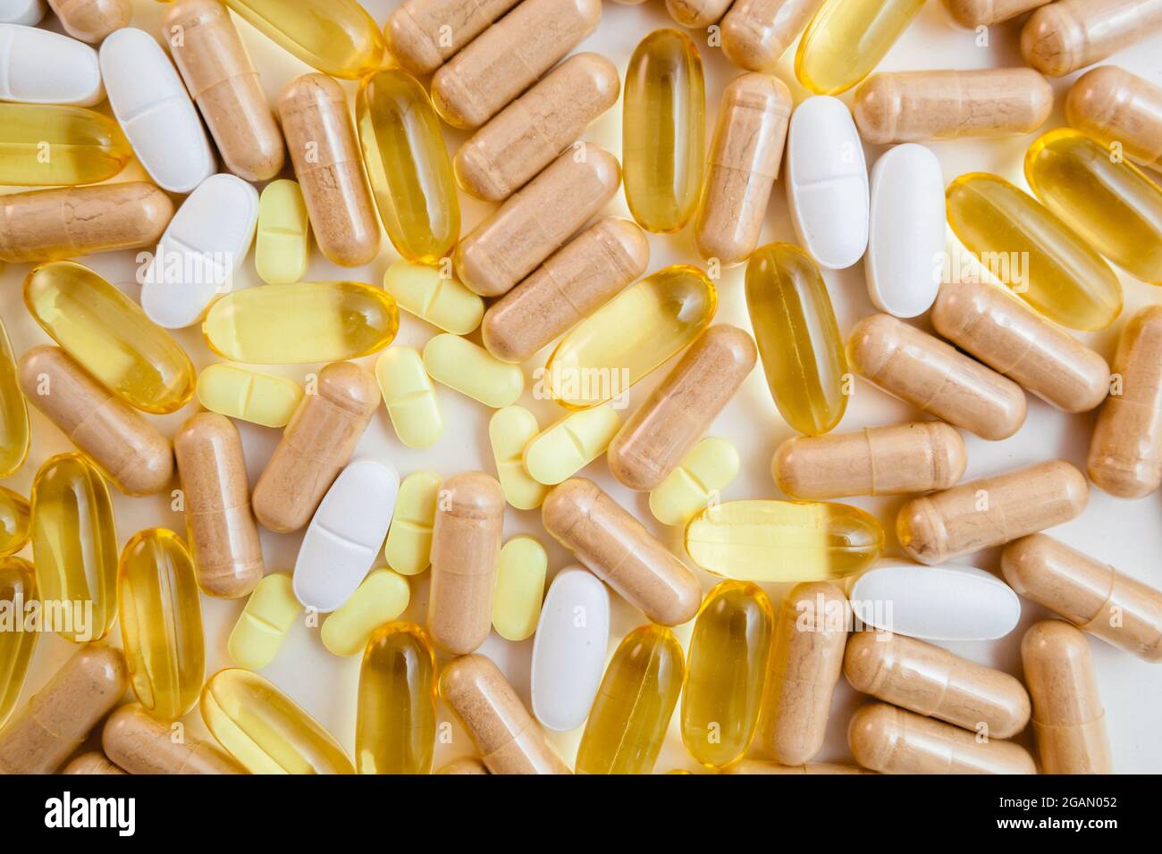 Different pills capsules pills on white isolated background texture ...