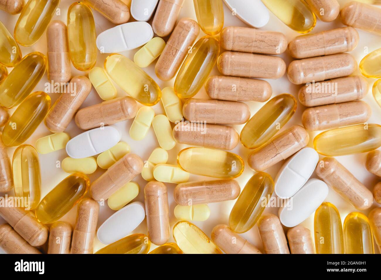 Different pills capsules pills on white isolated background texture ...
