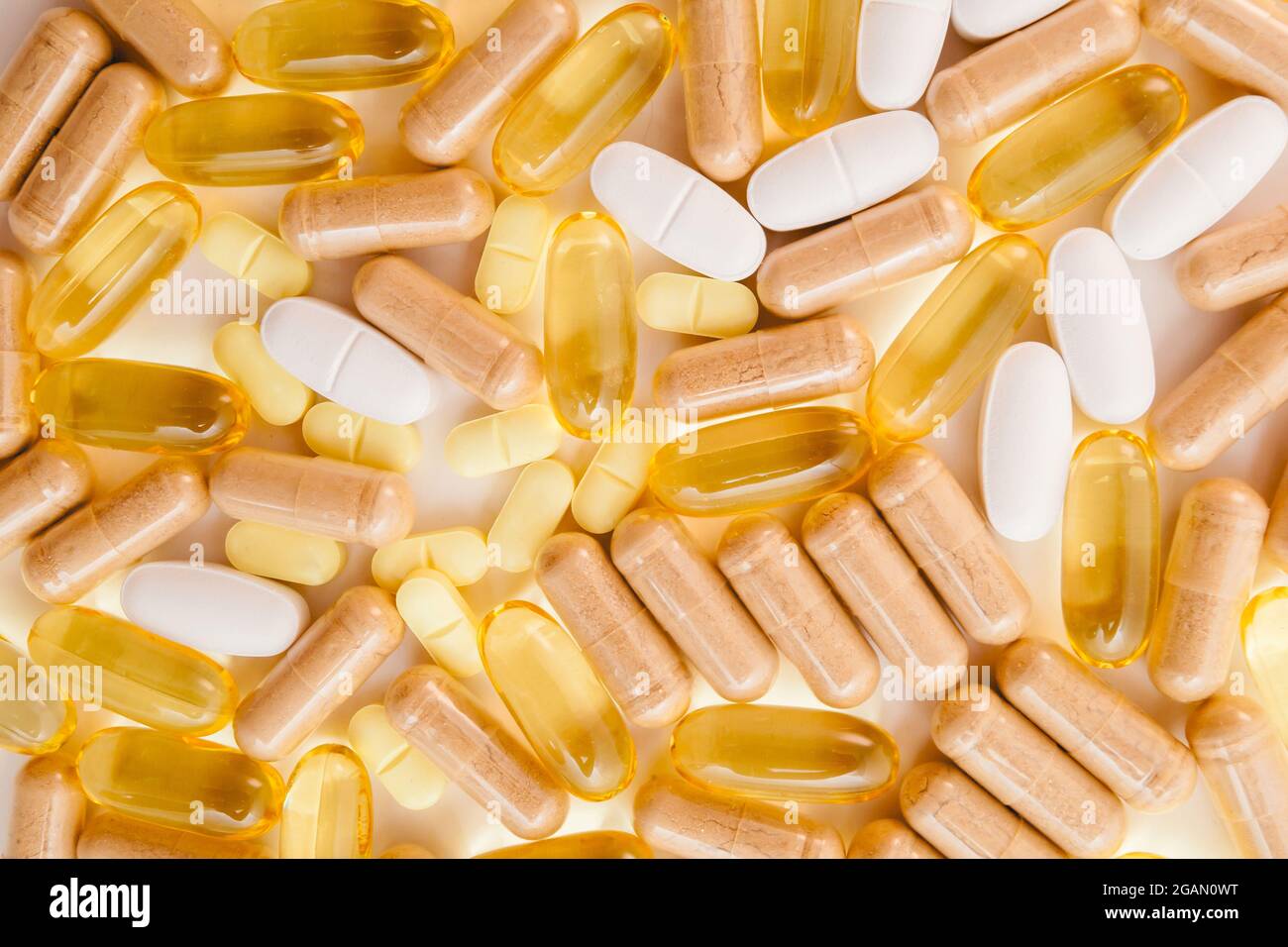Different pills capsules pills on white isolated background texture ...