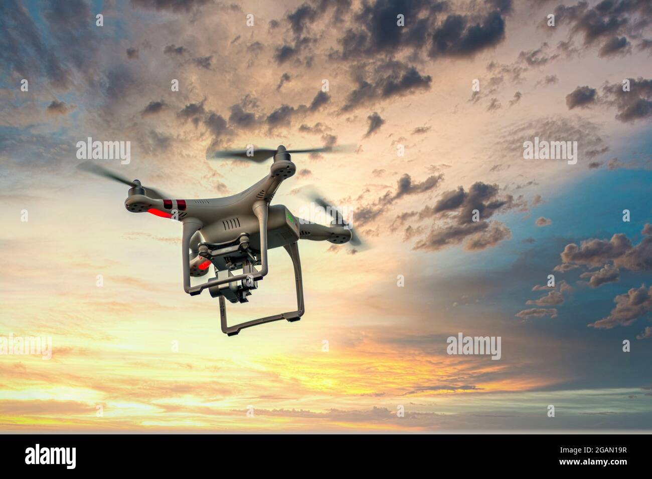 A drone captures stunning sunset views over a dramatic sky filled with ...