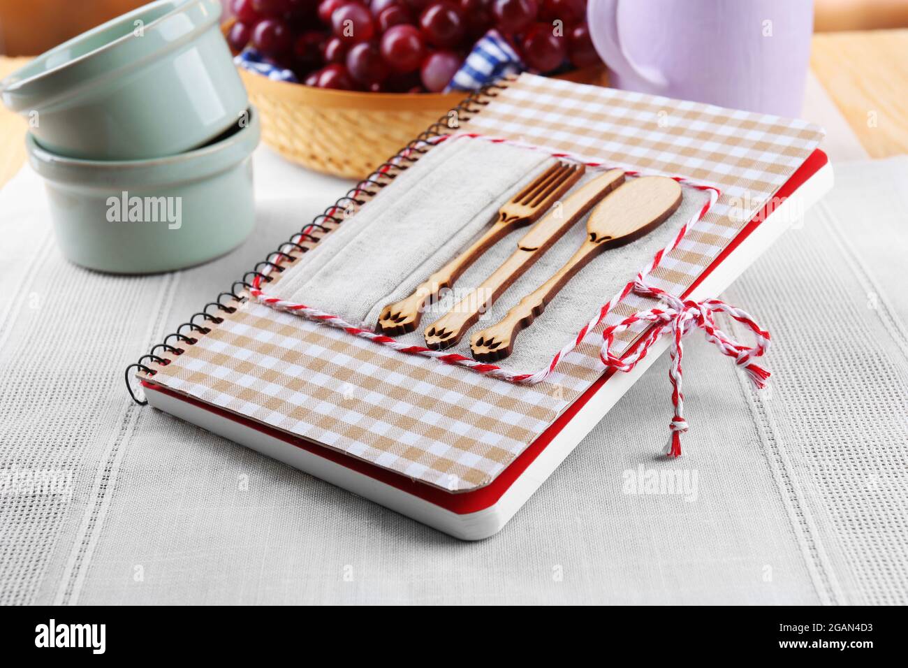 Recipe book at the kitchen on table background Stock Photo - Alamy