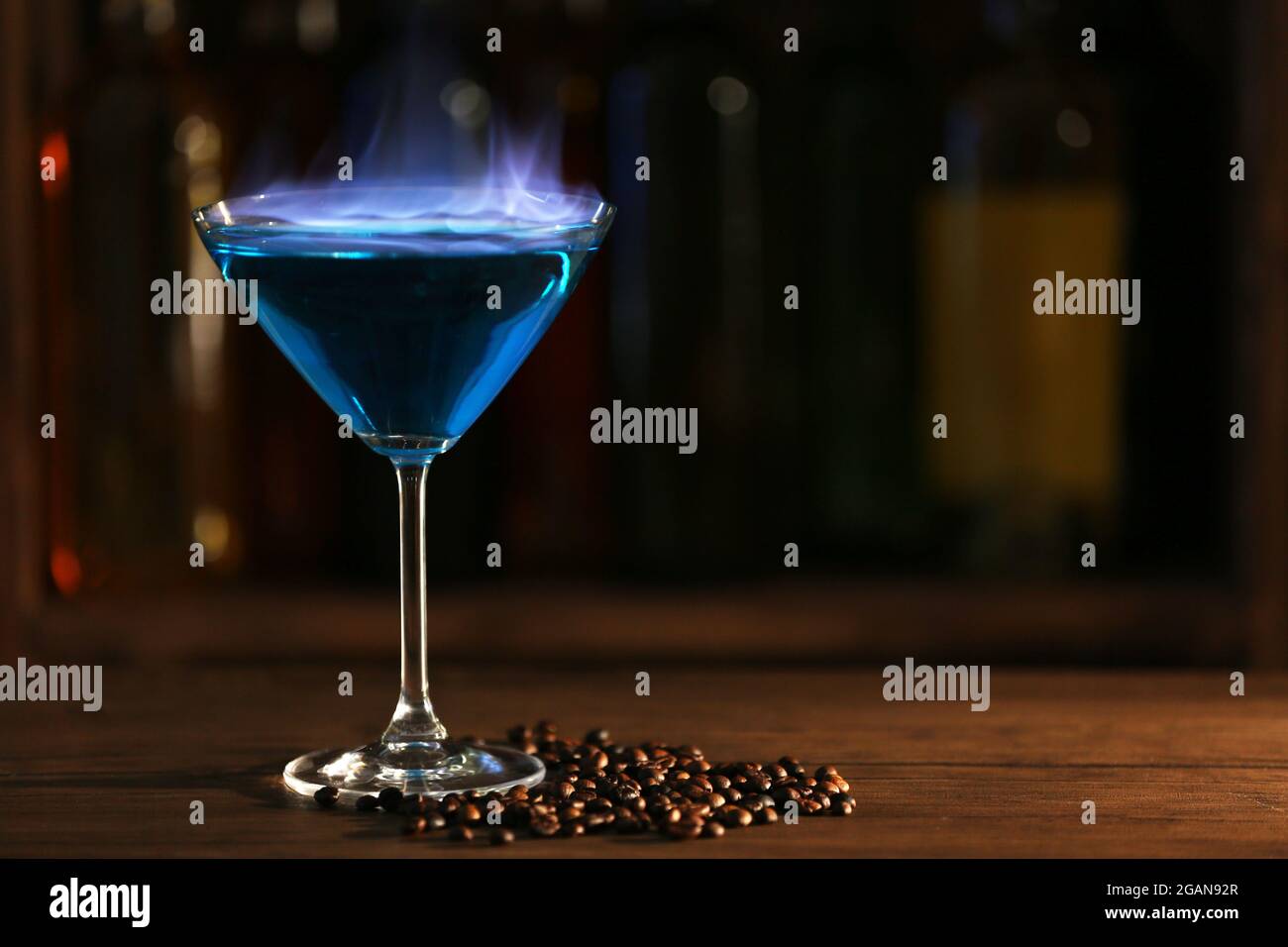 Burning cocktail on table in a bar Stock Photo - Alamy