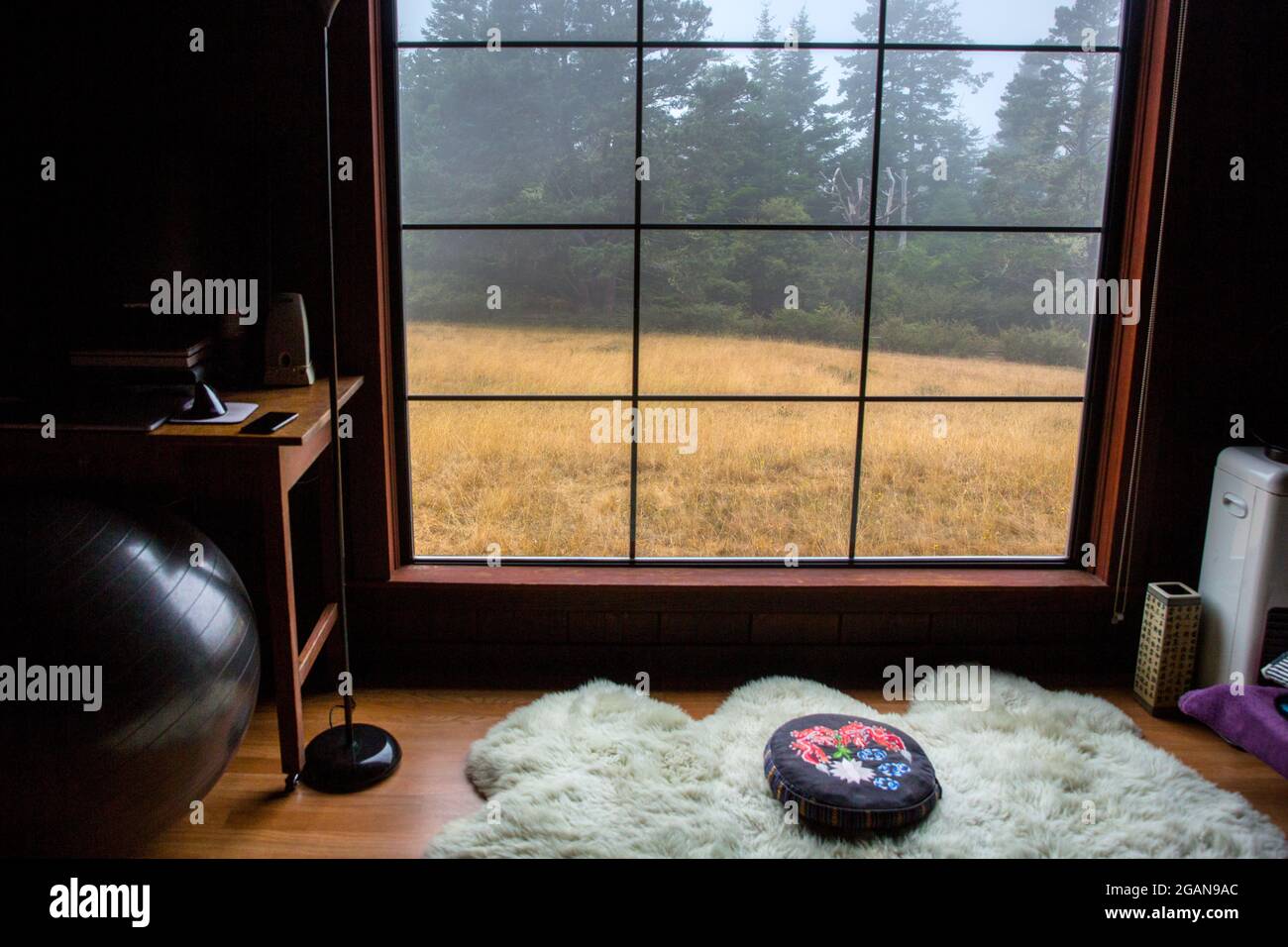Living room with a large window with a view of nature. Mendocino ...