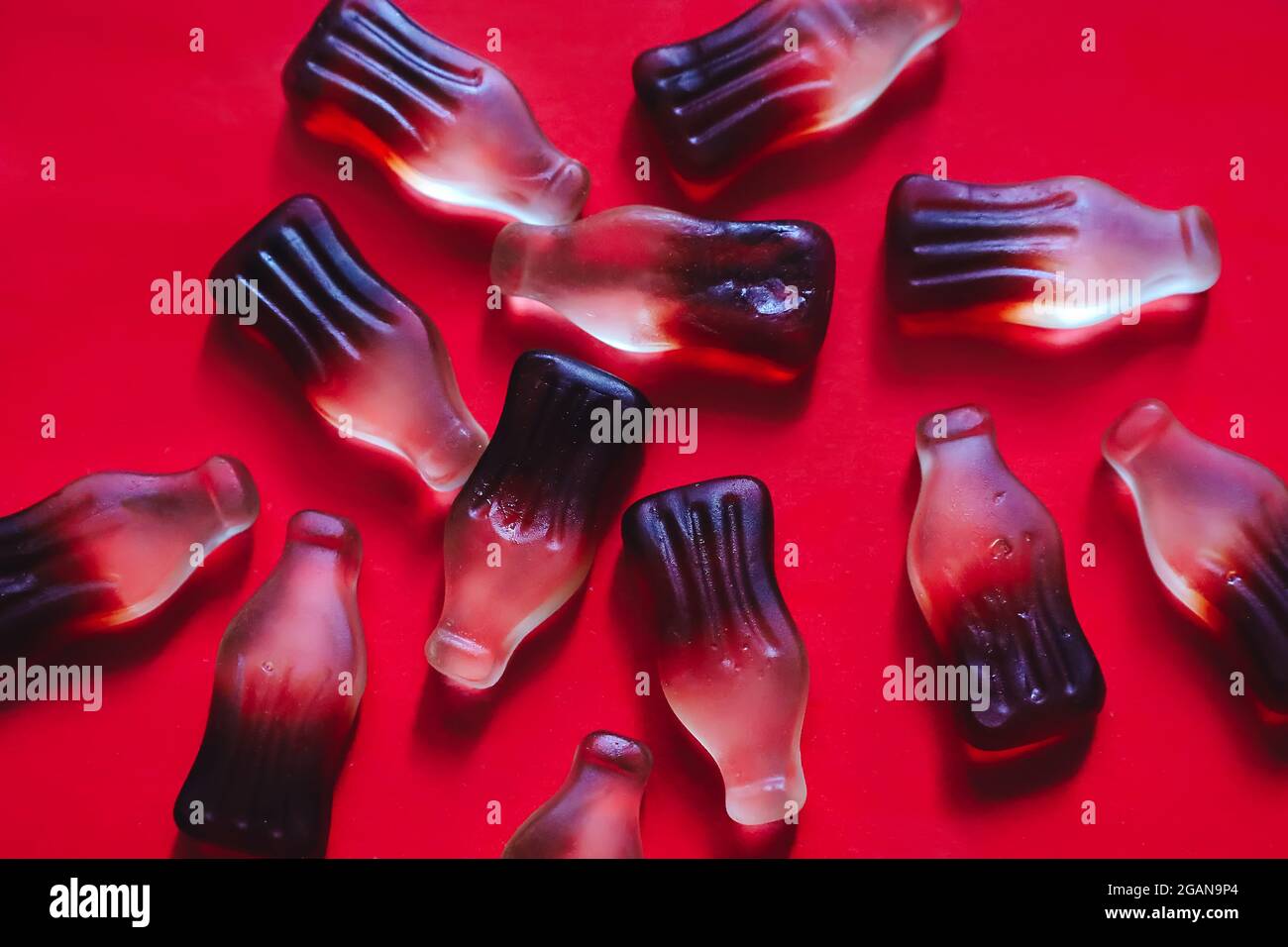 Cola gummy jelly candies in bottle shape, sweet backdrop Stock Photo ...