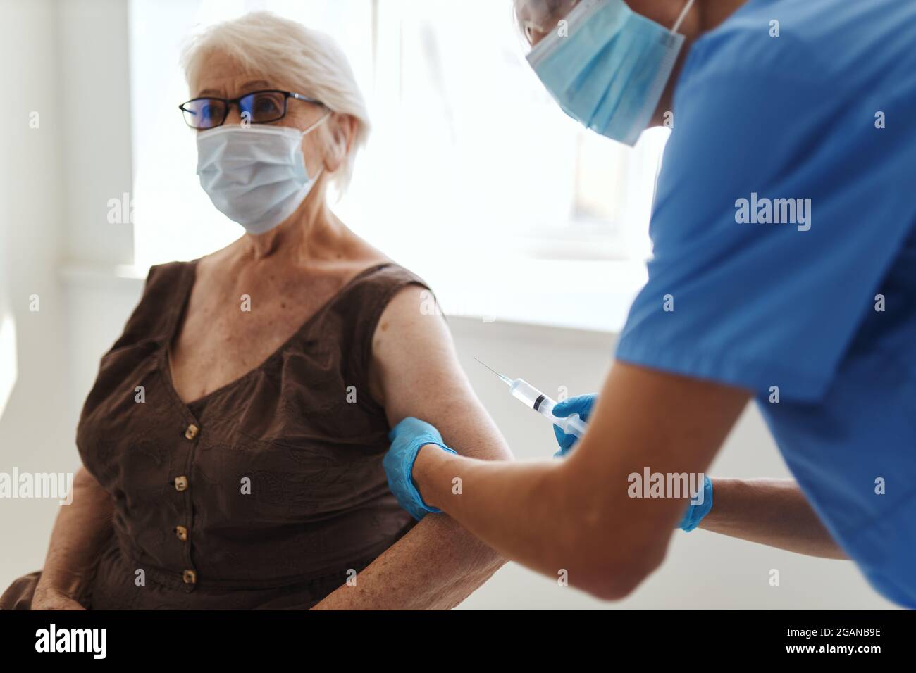 elderly woman patient getting vaccinated hospital immunization safety ...