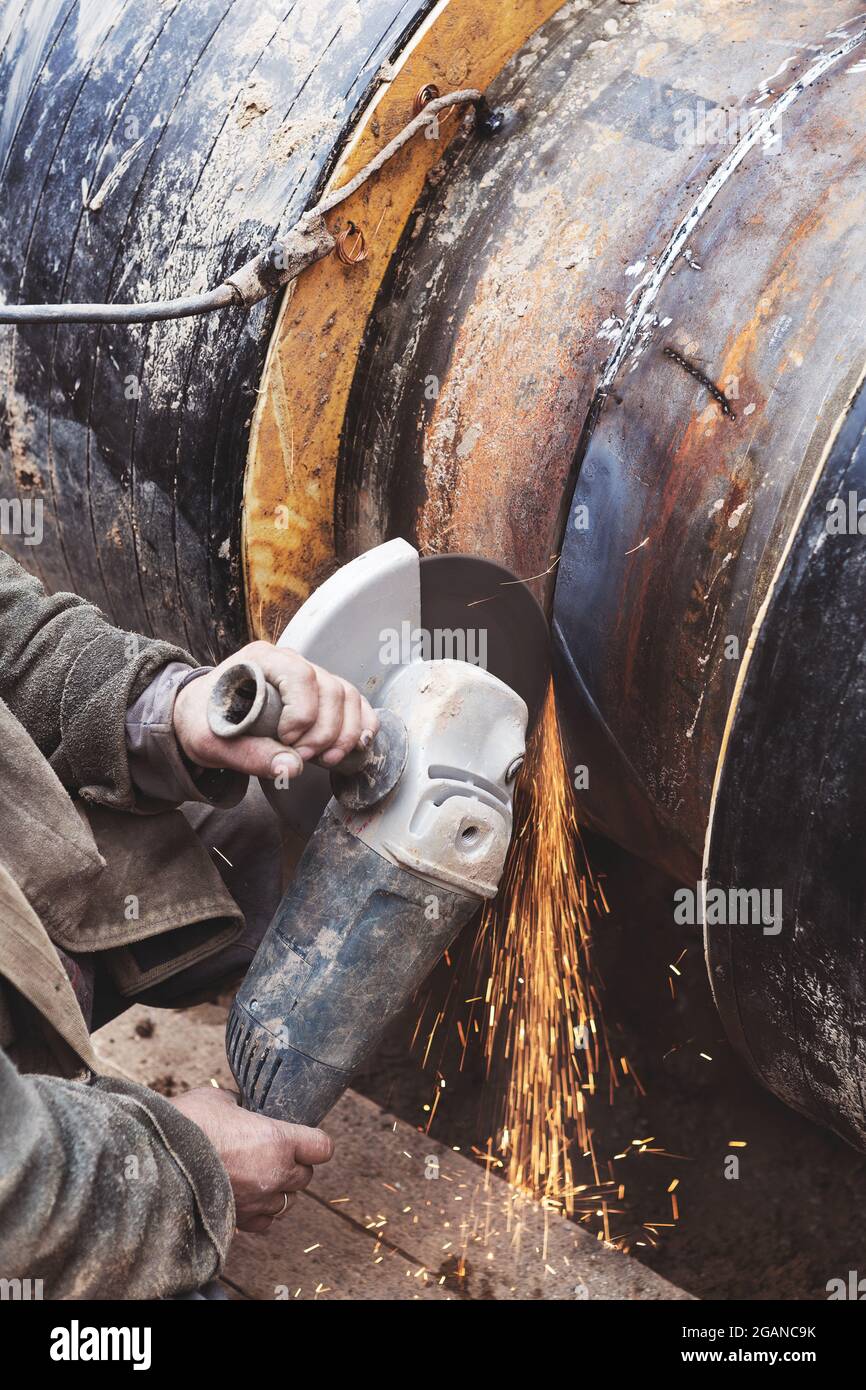 Repair of heating duct. The workers, welders made by electric welding ...