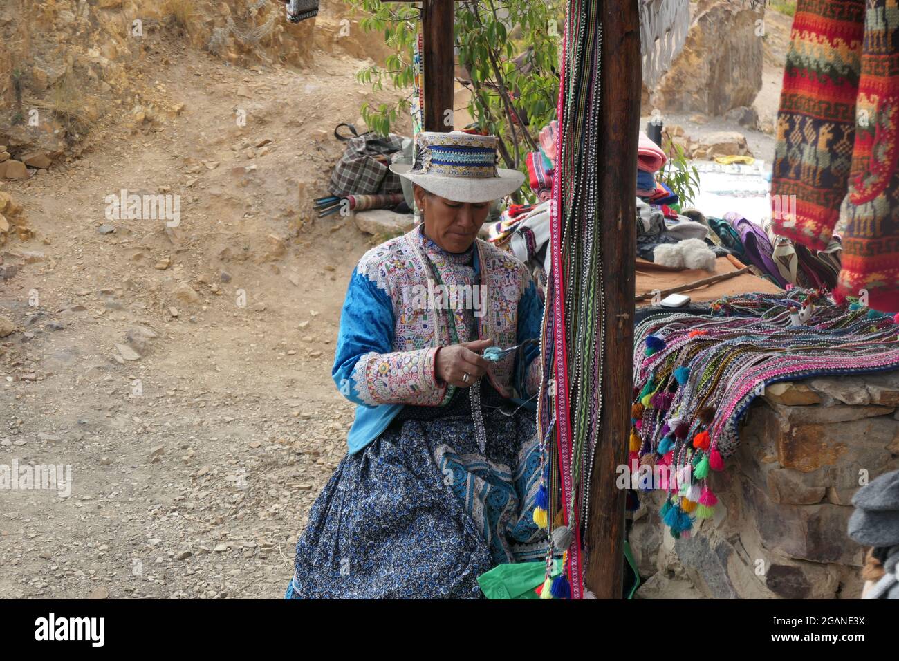 lady selling goods dressed in national costume with hat beads warm ...
