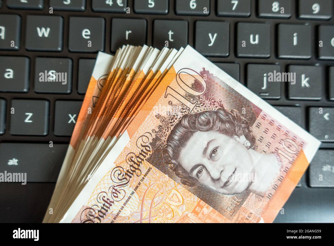 Internet money concept with english pound currency and keyboard in ...