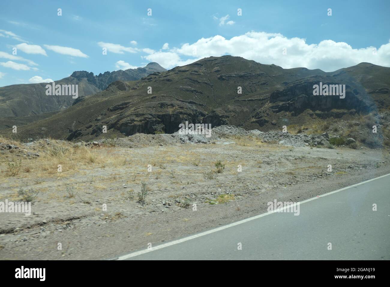 on the road to Puno Peru landscape weather clouds hot humid sky rocks ...