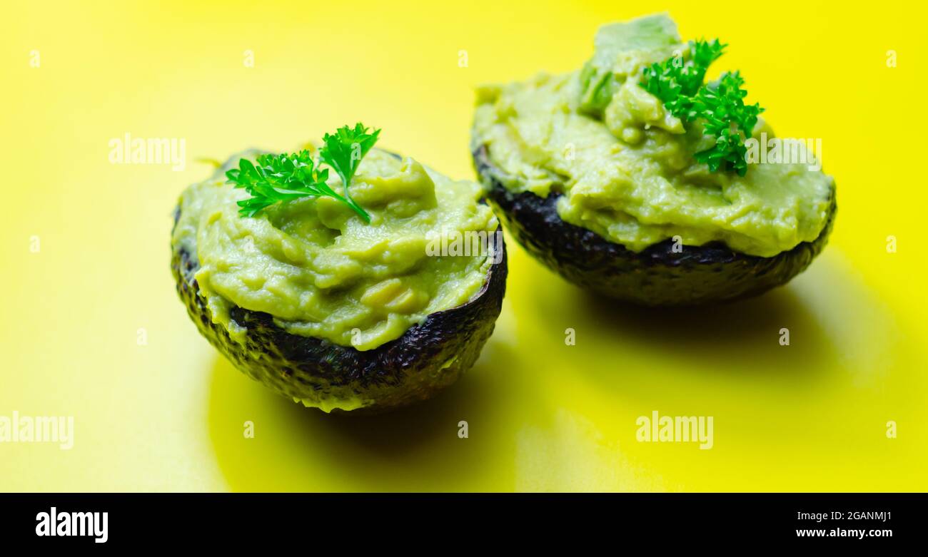 Smashed avocado, smother avocado with lemon juice served on the for ...