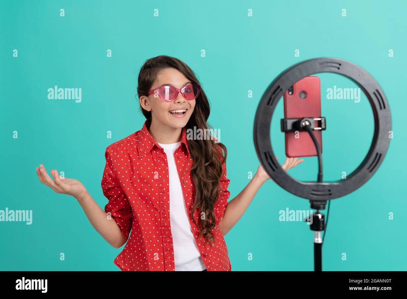 blogging light lamp. influencer communication. cheerful teen girl use ...