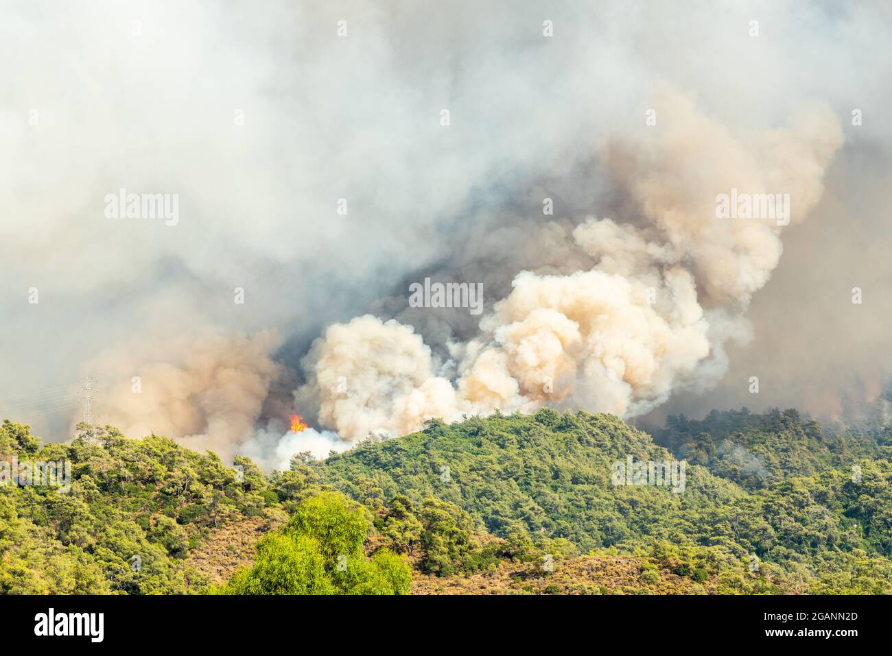Smoke from a forest fire rising over Hisaronu neighbourhood of Marmaris ...
